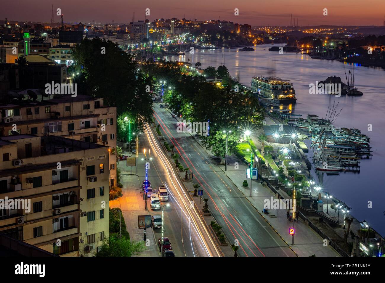 Aswan, Egypt - City overlook from the hotel rooftop at sunset Stock ...