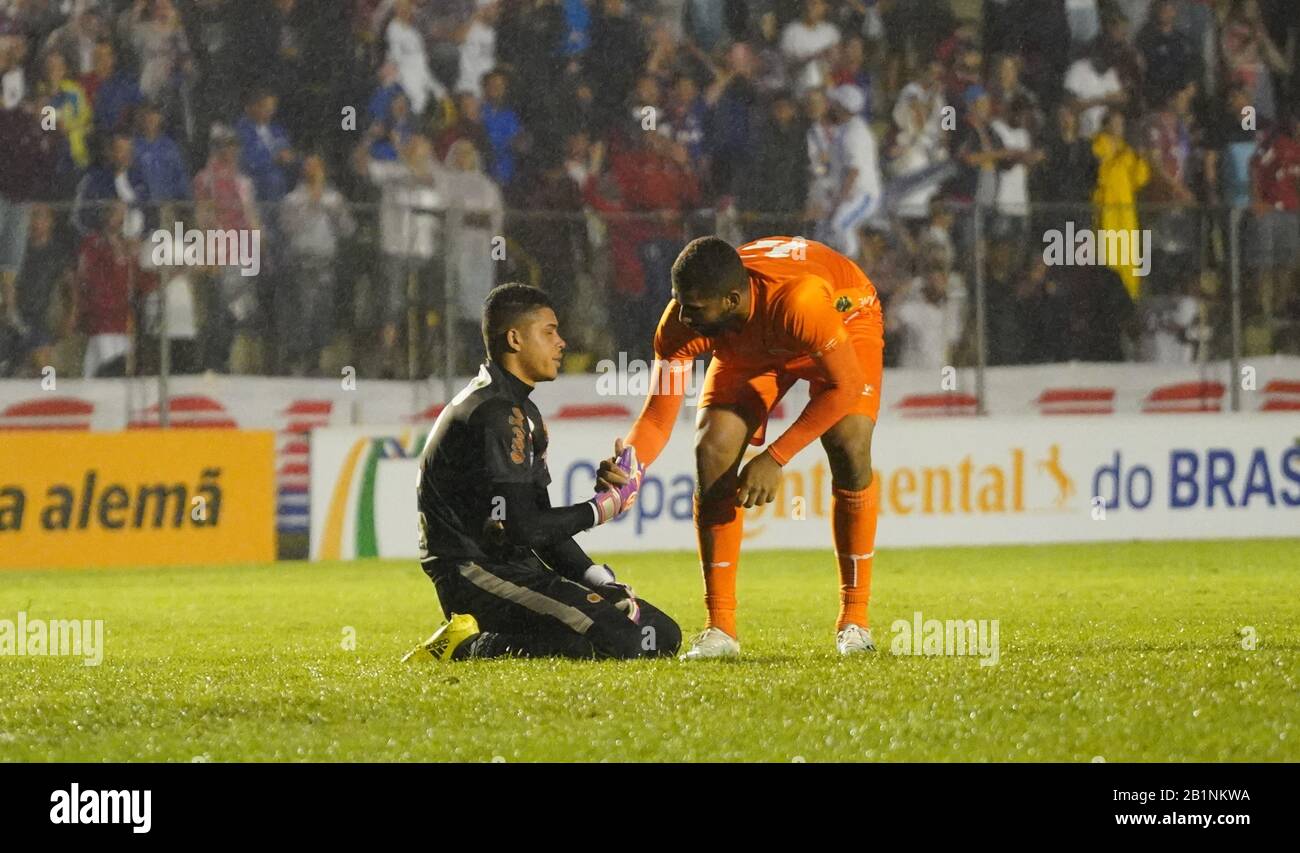 Curitiba, Brazil. 26th Feb, 2020. Desolate Alan goal is comforted by ...