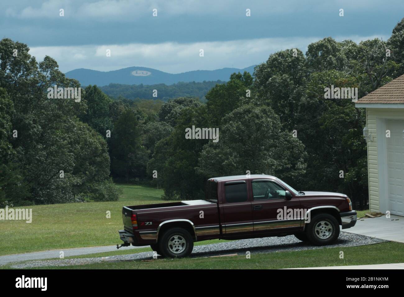 Pickup truck parked in a home's driveway. View of the LU (Liberty ...