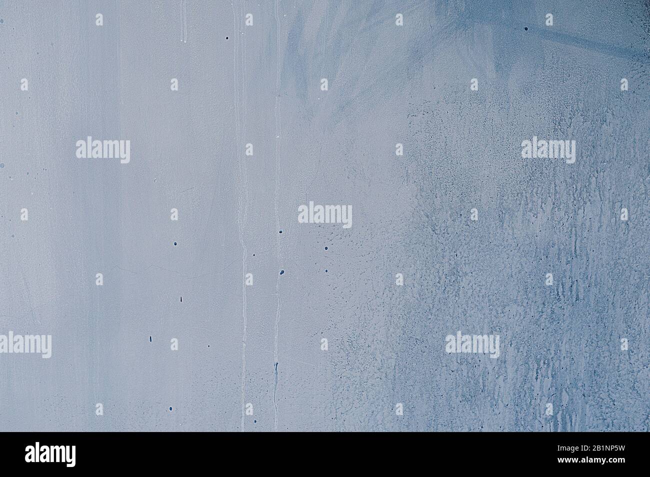 blue concrete wall texture with cracks and bumps and traces of flowing ...