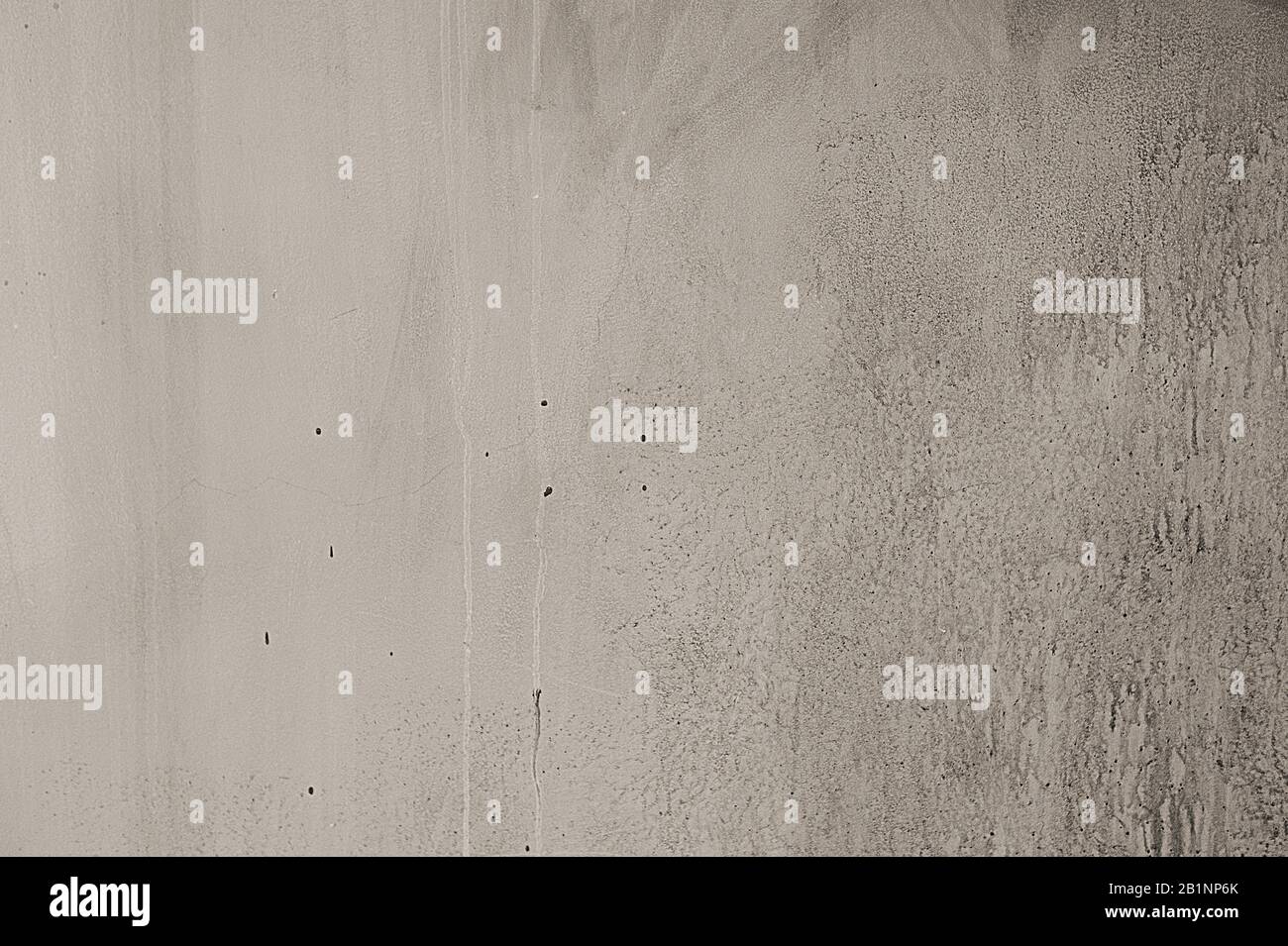 white concrete wall texture with cracks and bumps and traces of flowing ...