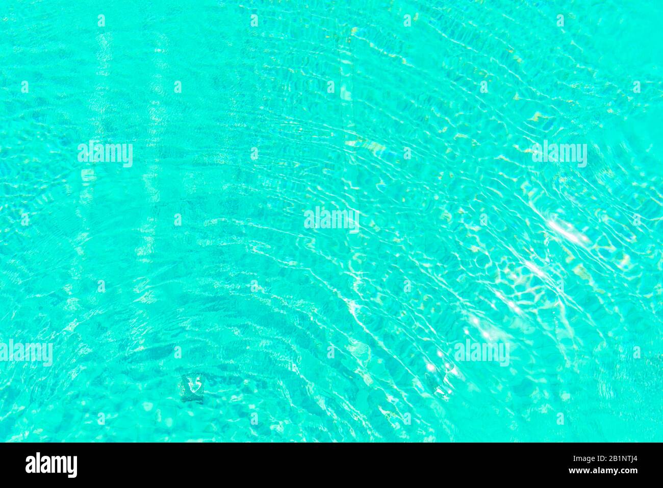 Surface of shining swimming pool water ripple in futuristic green ...
