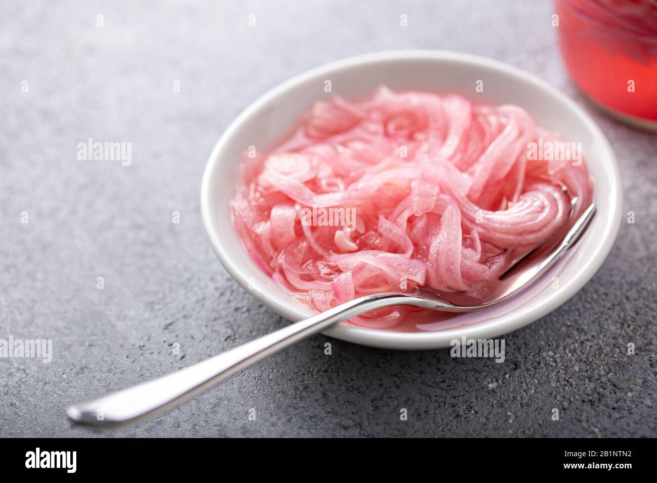 Marinated red onion in small bowl Stock Photo - Alamy