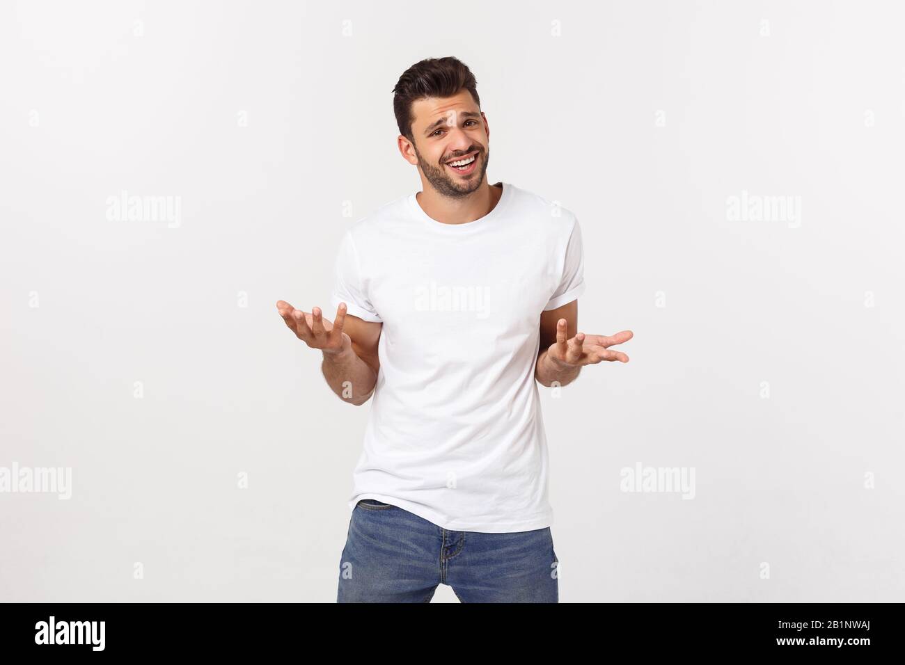 Charming handsome. Handsome young man in casual wear while standing ...