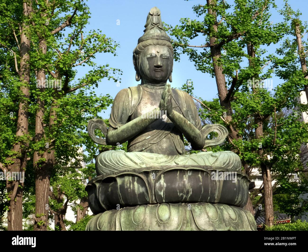 TOKYO, JAPAN - APRIL, 20, 2018: a buddha statue in the gardens of senso ...