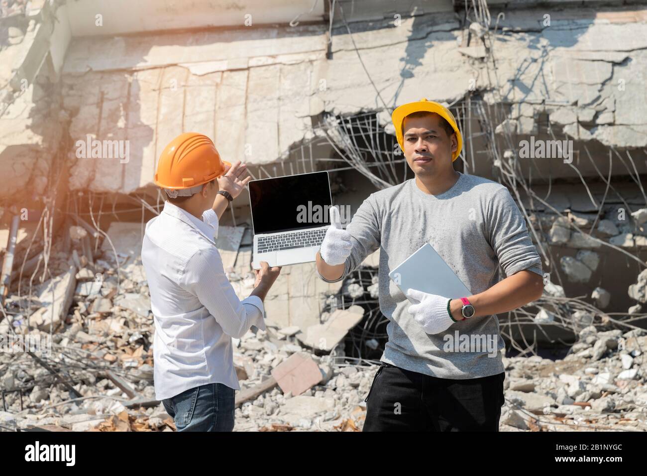 Demolition control supervisor or foreman thumbs up on demolish building ...