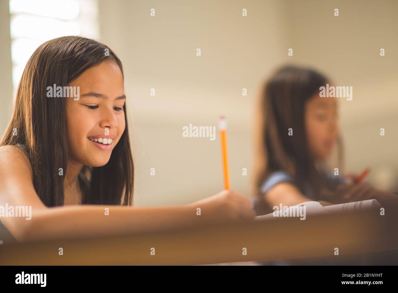 Young Girls Working On Their School Work Stock Photo - Alamy