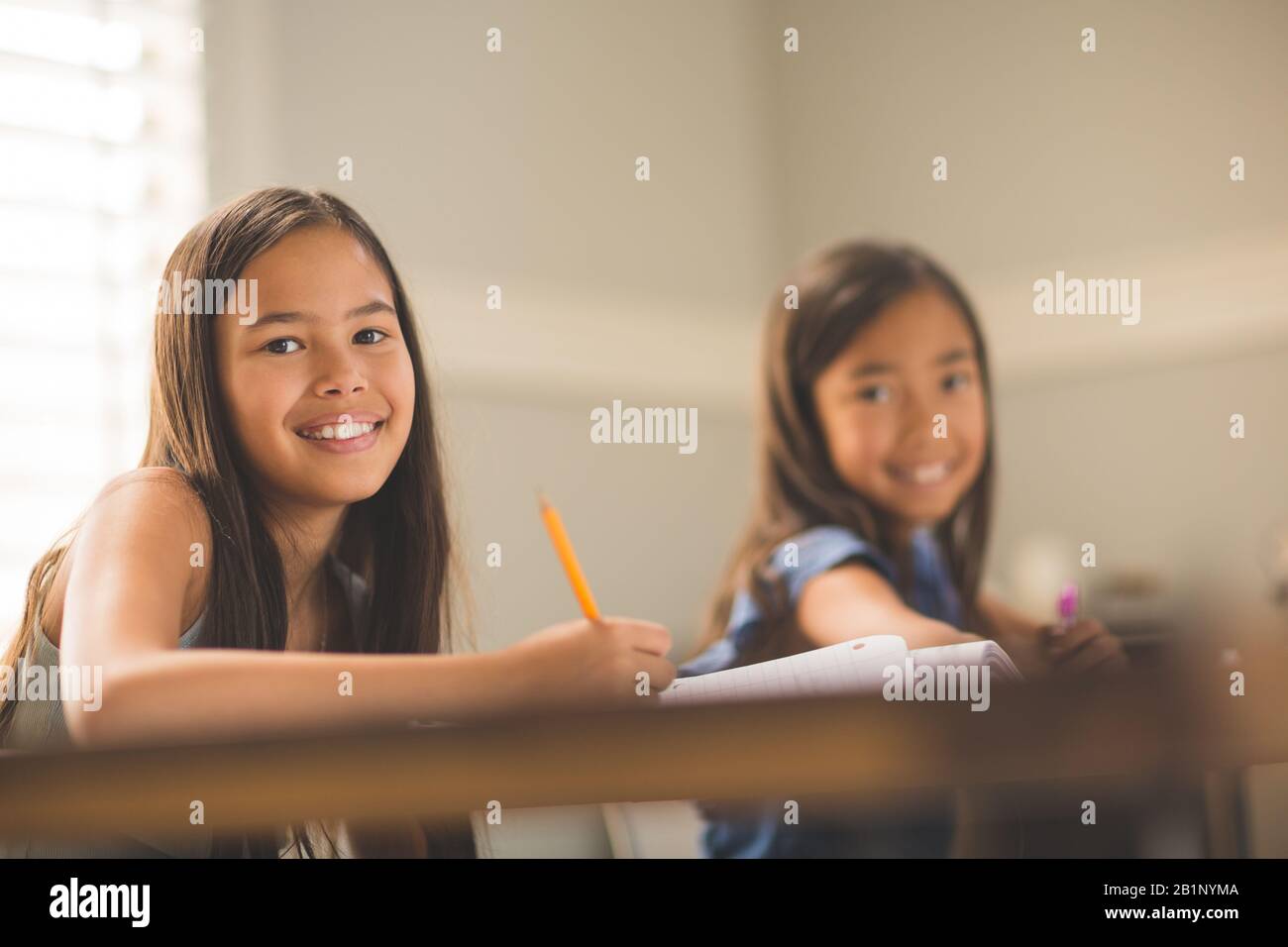 Young Girls Working On Their School Work Stock Photo - Alamy