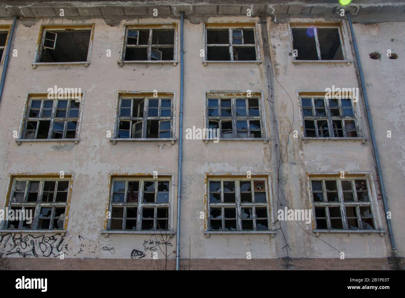 Broken damaged glass windows on a building, outdoors. Damaged window ...