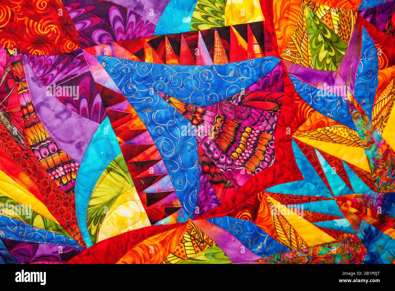 beautiful handmade quilt in bright colors Stock Photo - Alamy