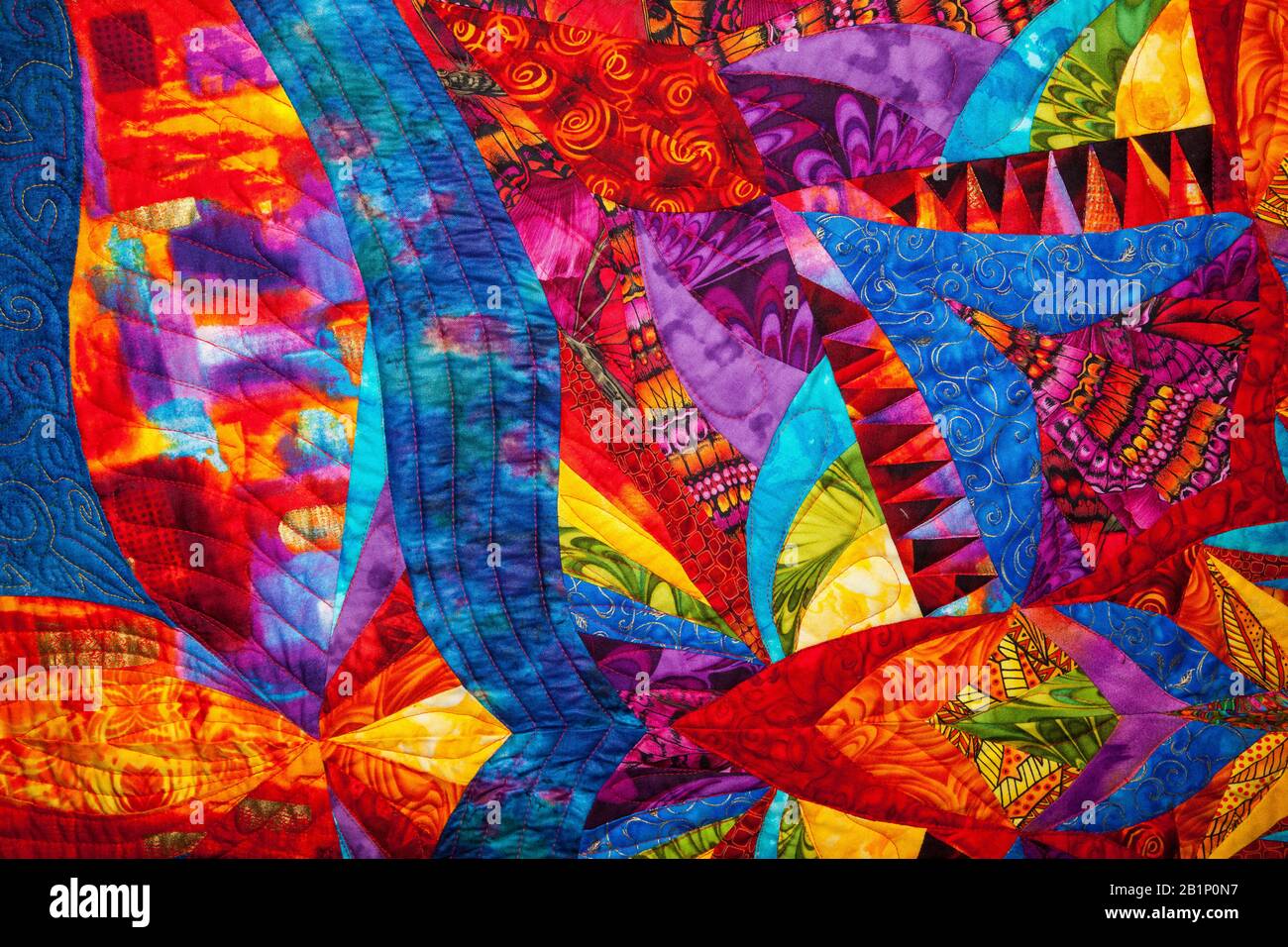 beautiful handmade quilt in bright colors Stock Photo - Alamy