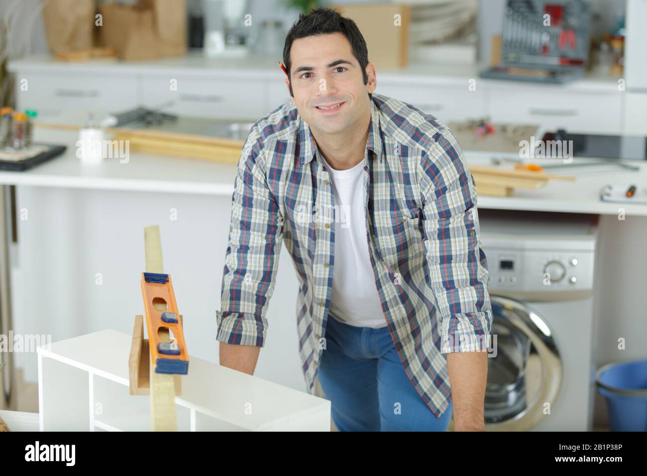 man working using leveling tool Stock Photo - Alamy