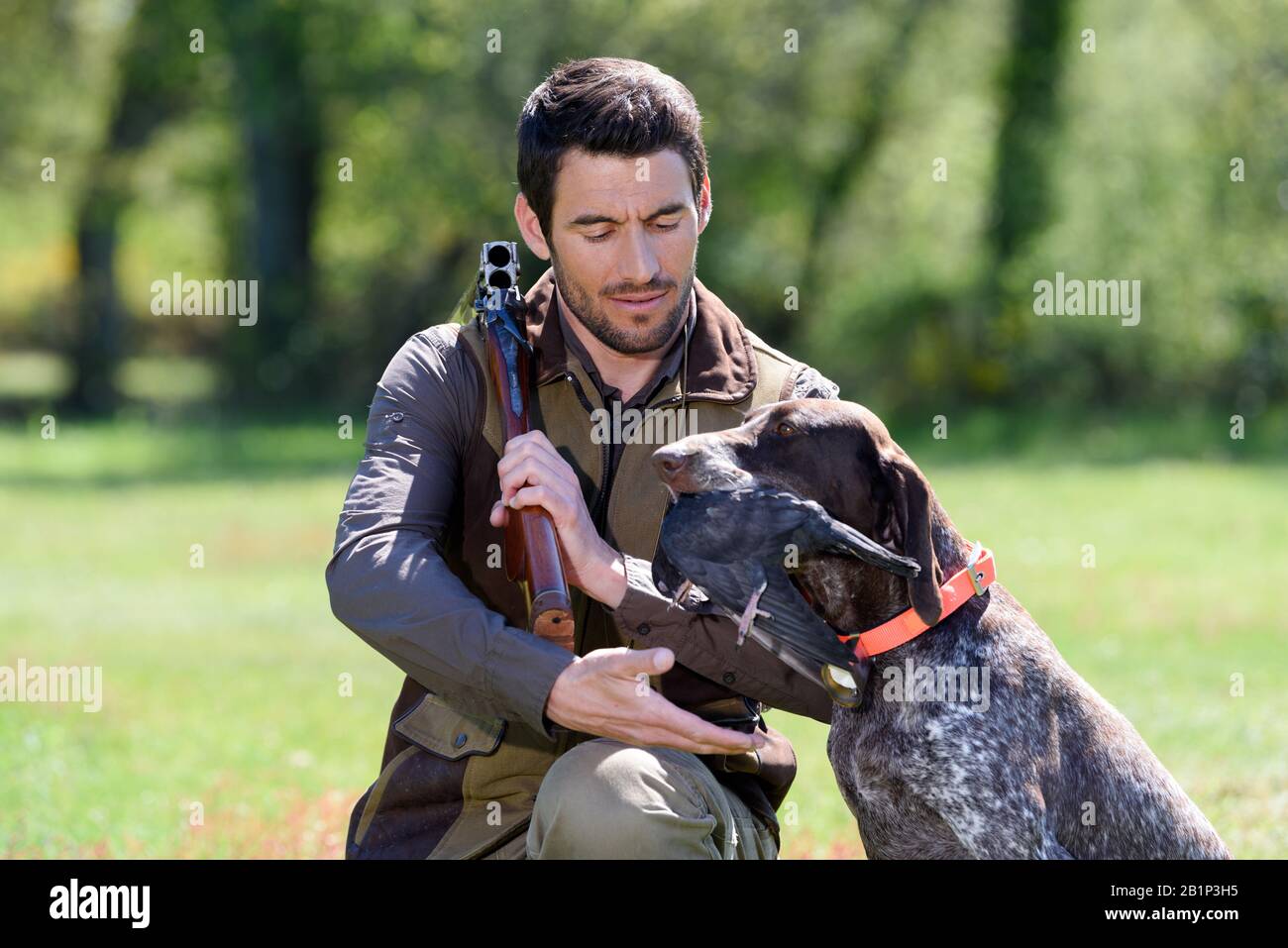 portrait of hunter with dog Stock Photo - Alamy