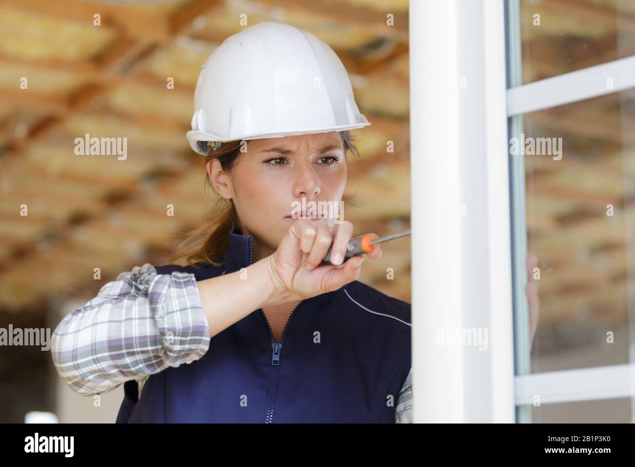 Woman fitting windows hi-res stock photography and images - Alamy