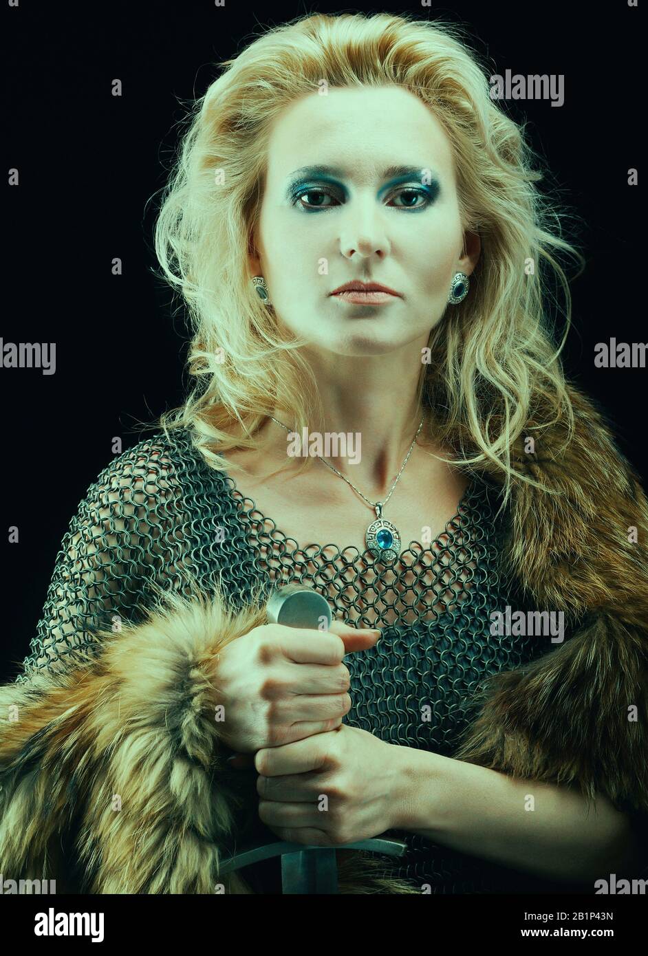 Valkyrie.Viking girl with sword Stock Photo - Alamy