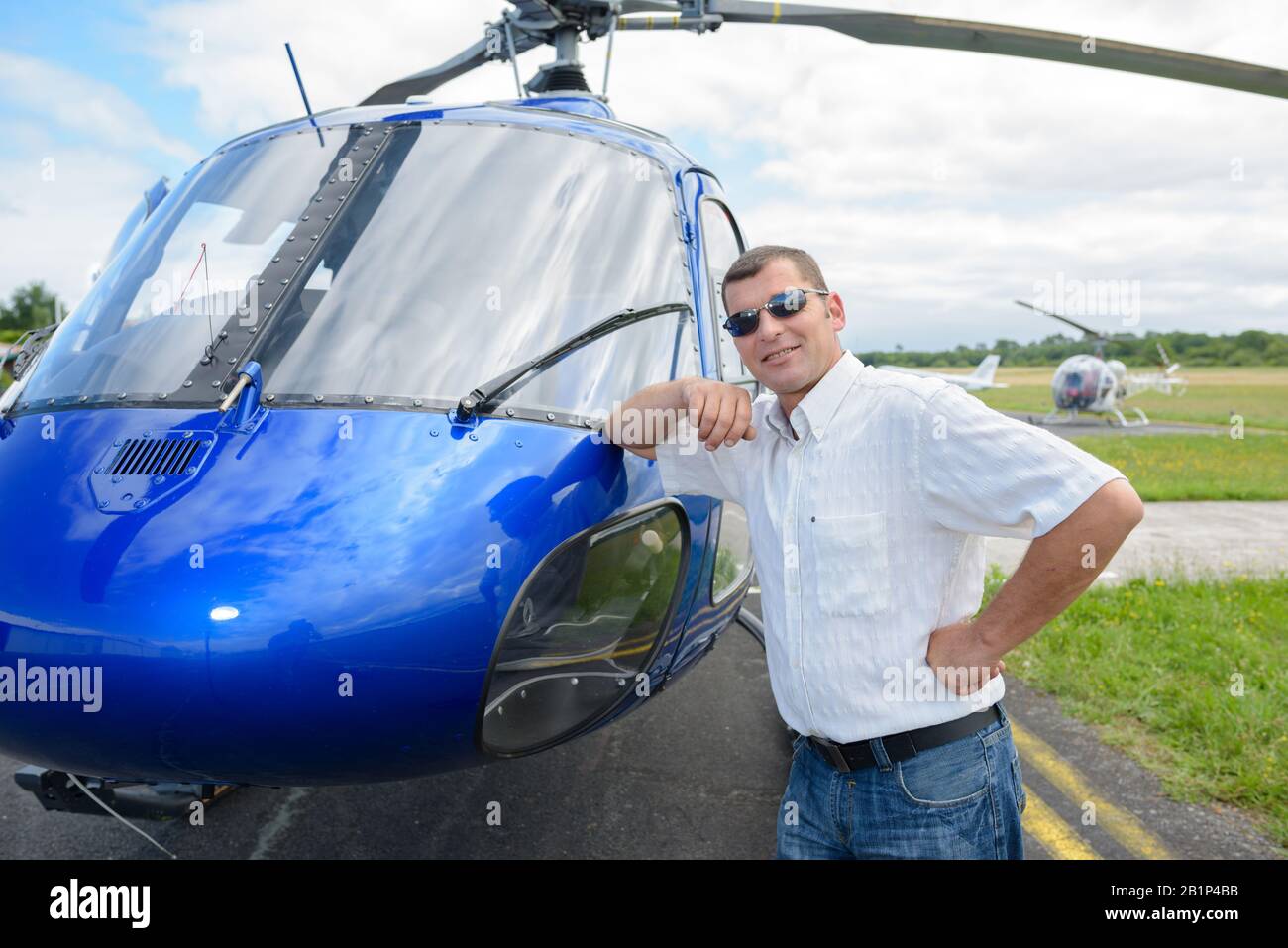 a man next to helicopter Stock Photo - Alamy