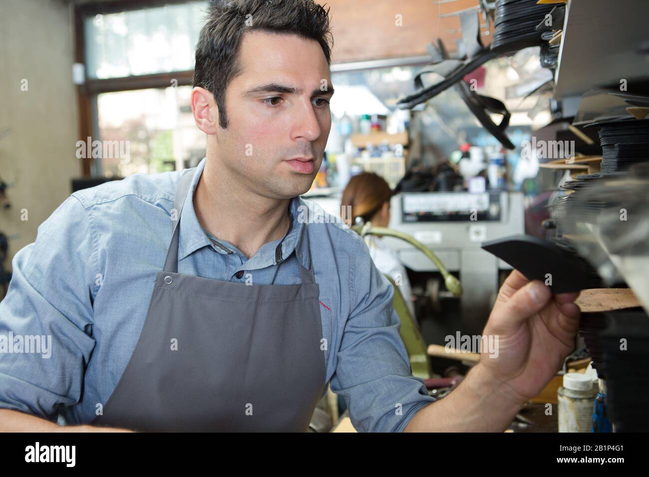 Fixing things clothing hi-res stock photography and images - Alamy