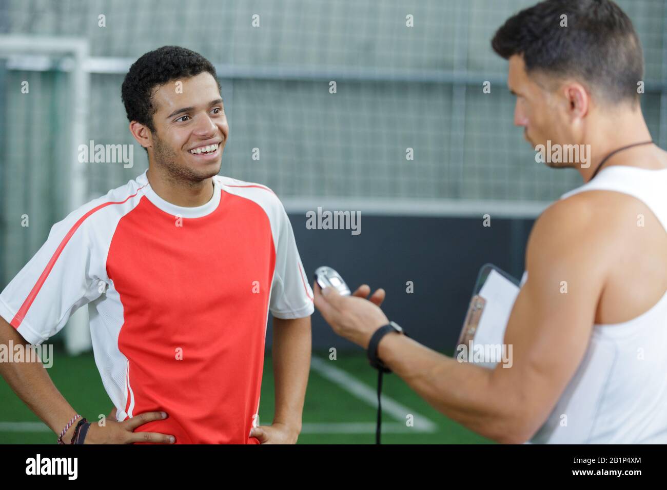 football coach holding stop watch Stock Photo - Alamy
