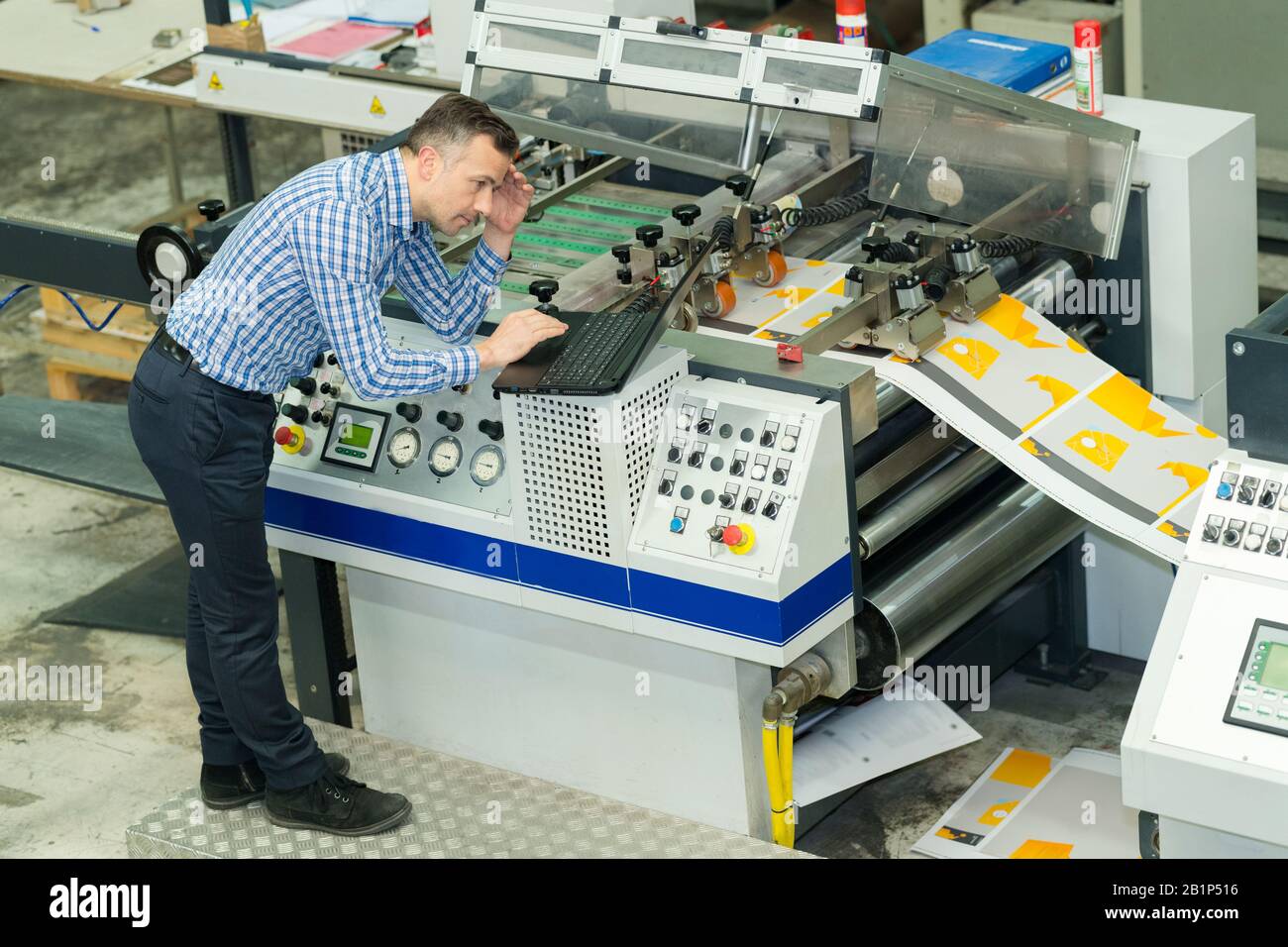 working in a printing factory Stock Photo - Alamy