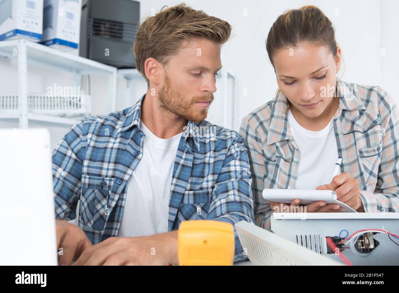 team of technicians working together Stock Photo - Alamy