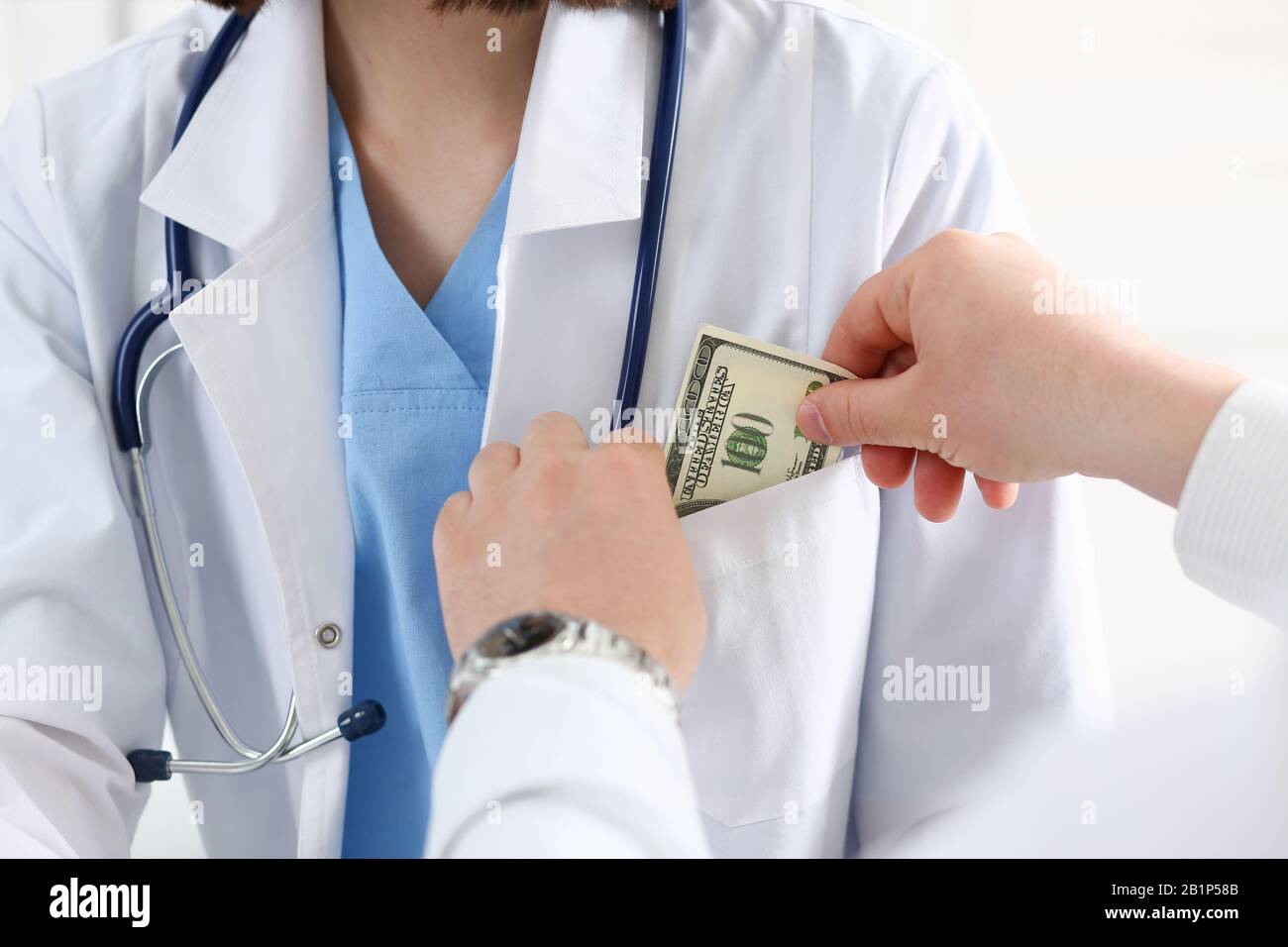 Female medicine doctor chest with bunch of hundred dollars bankn Stock ...