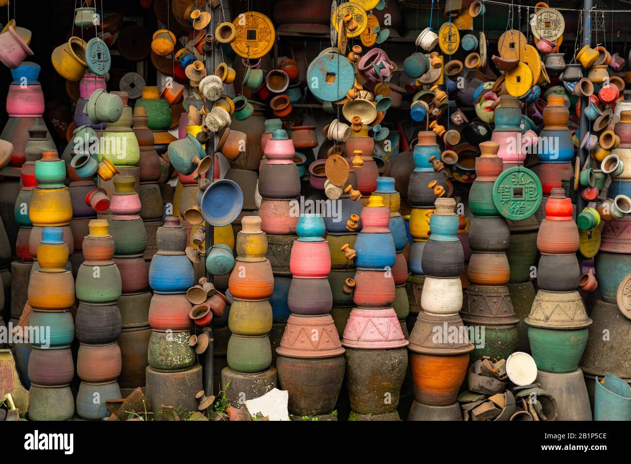 Colored showcase with clay pots on market Stock Photo - Alamy