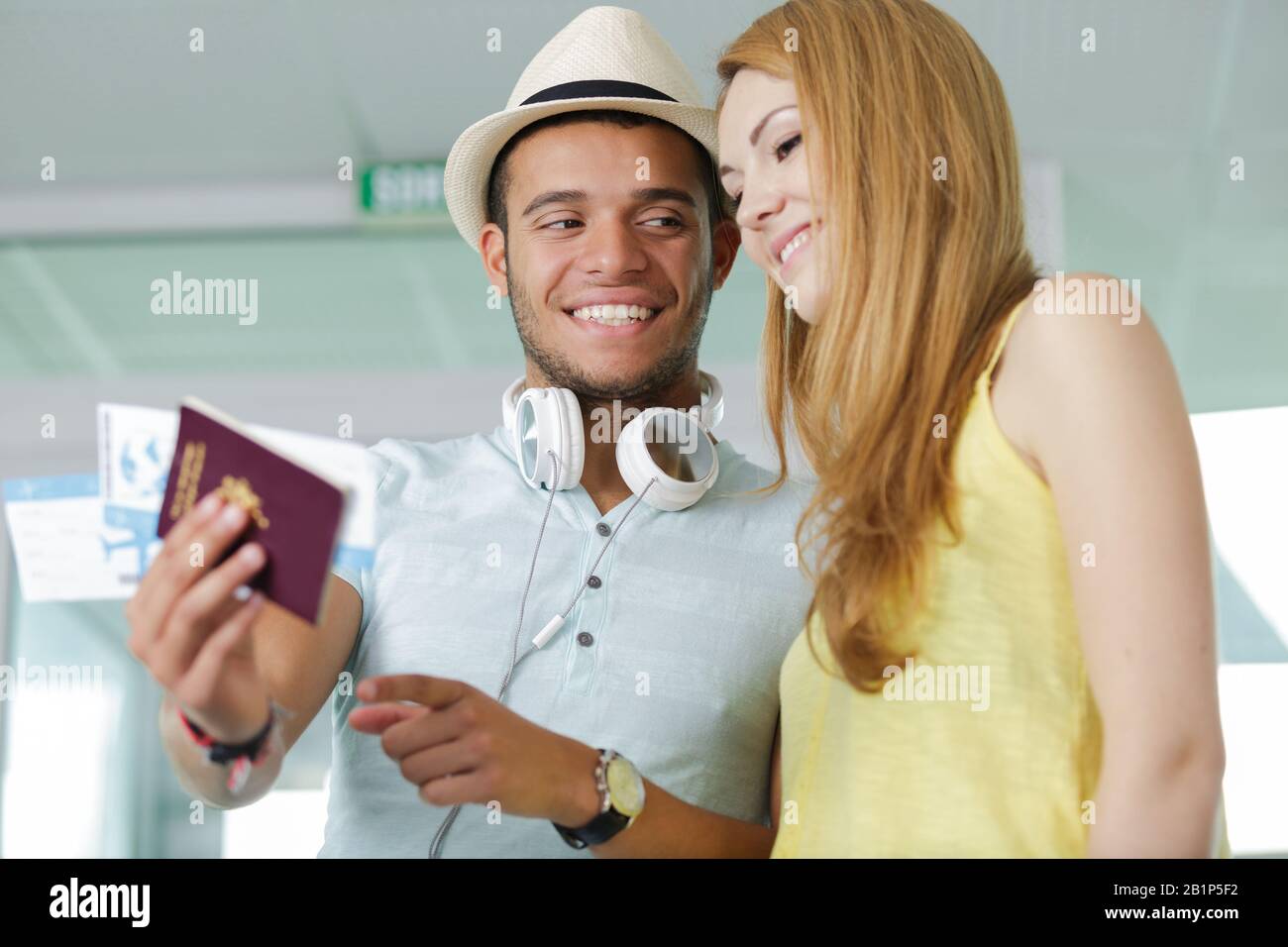 Couple with plane tickets hi-res stock photography and images - Alamy