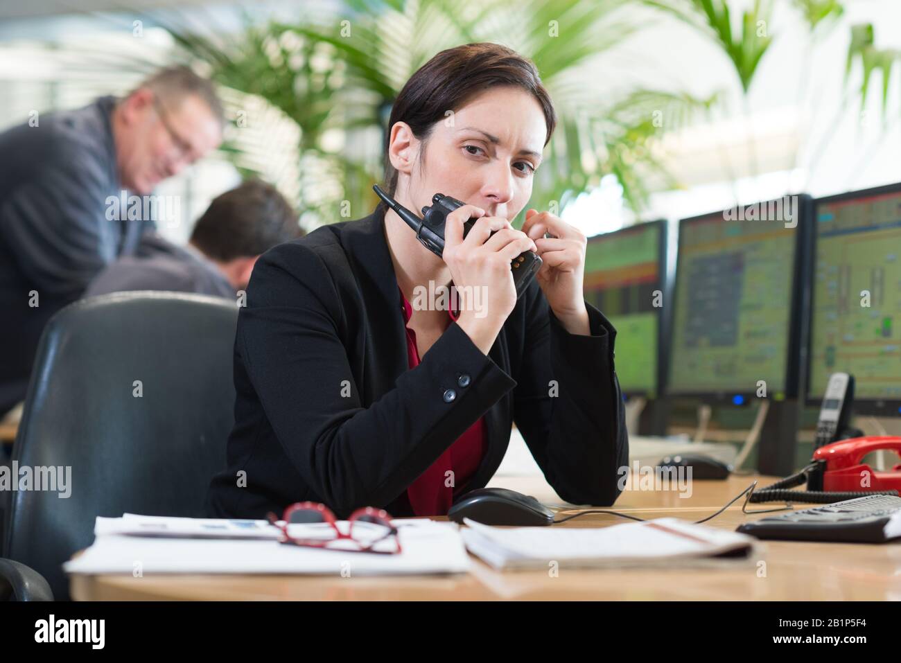 beautiful security guard in surveillance room Stock Photo - Alamy