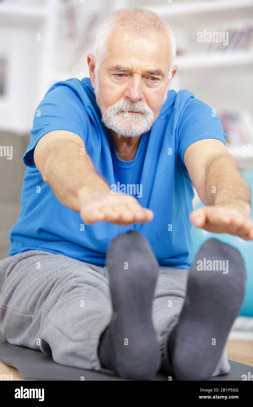 senior fitness man warm up training indoors Stock Photo - Alamy