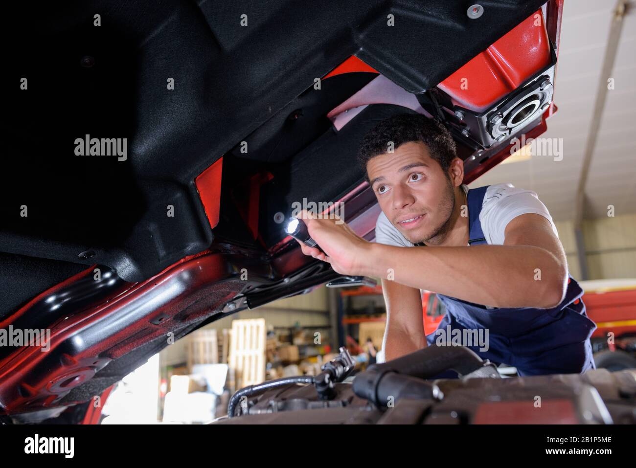 man repairing a truck motor Stock Photo - Alamy