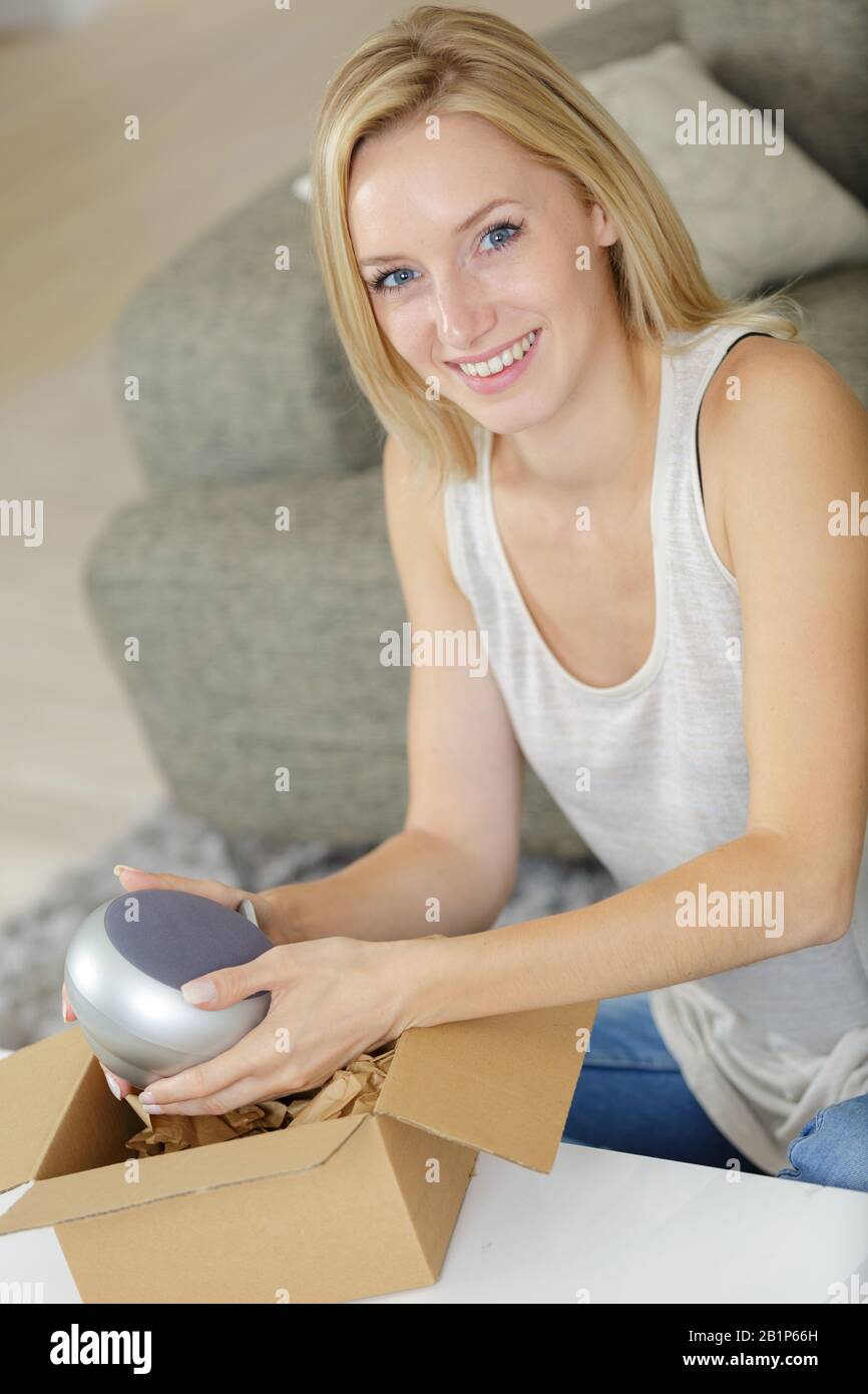 a woman with a box Stock Photo - Alamy