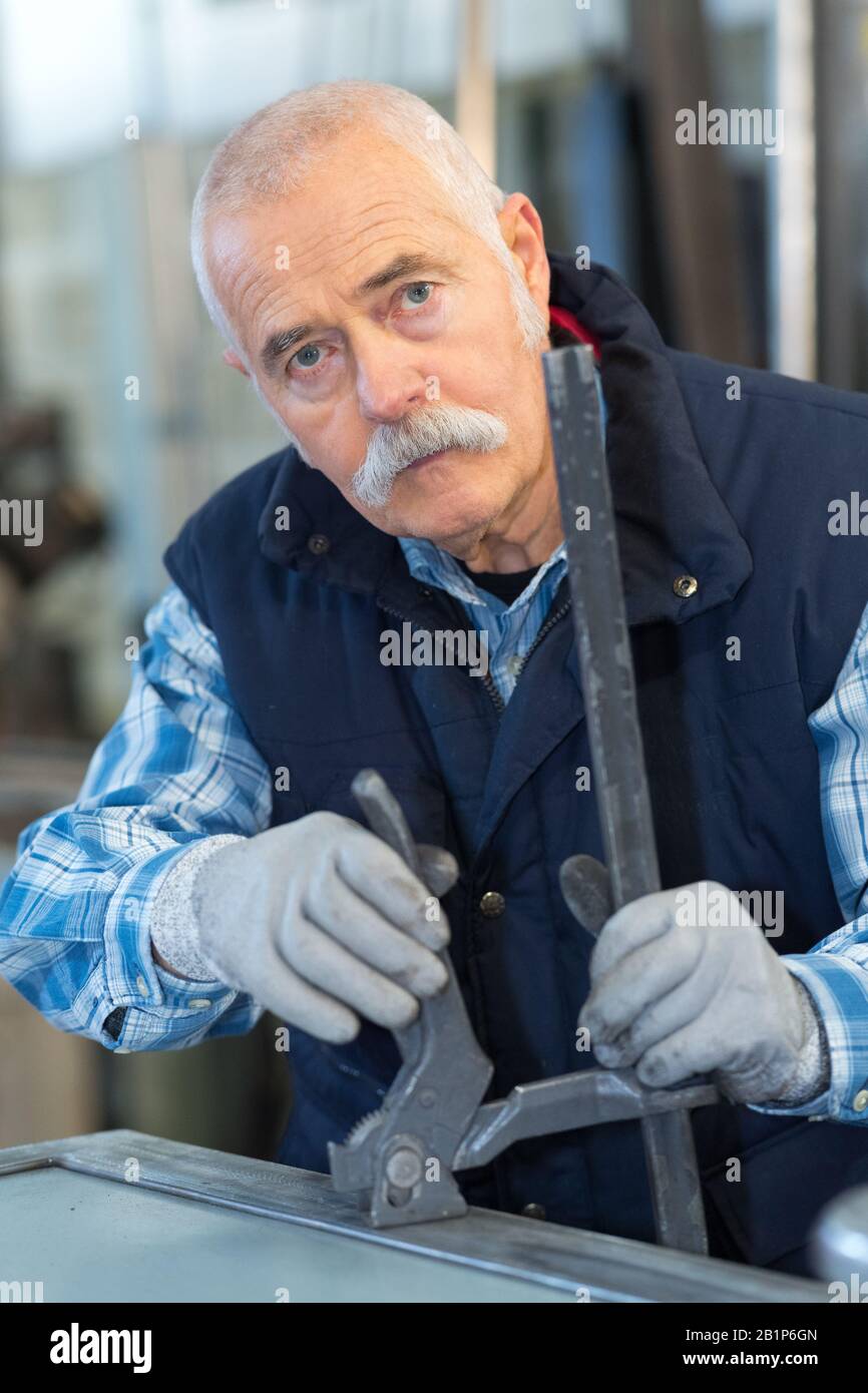 factory worker using industrial clamps Stock Photo - Alamy