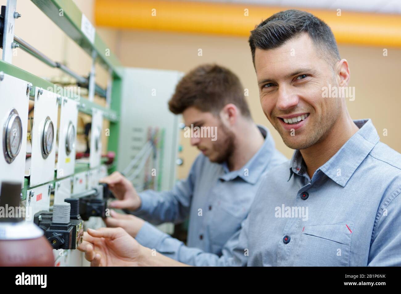 mechanical engineering worker operates a machine Stock Photo - Alamy