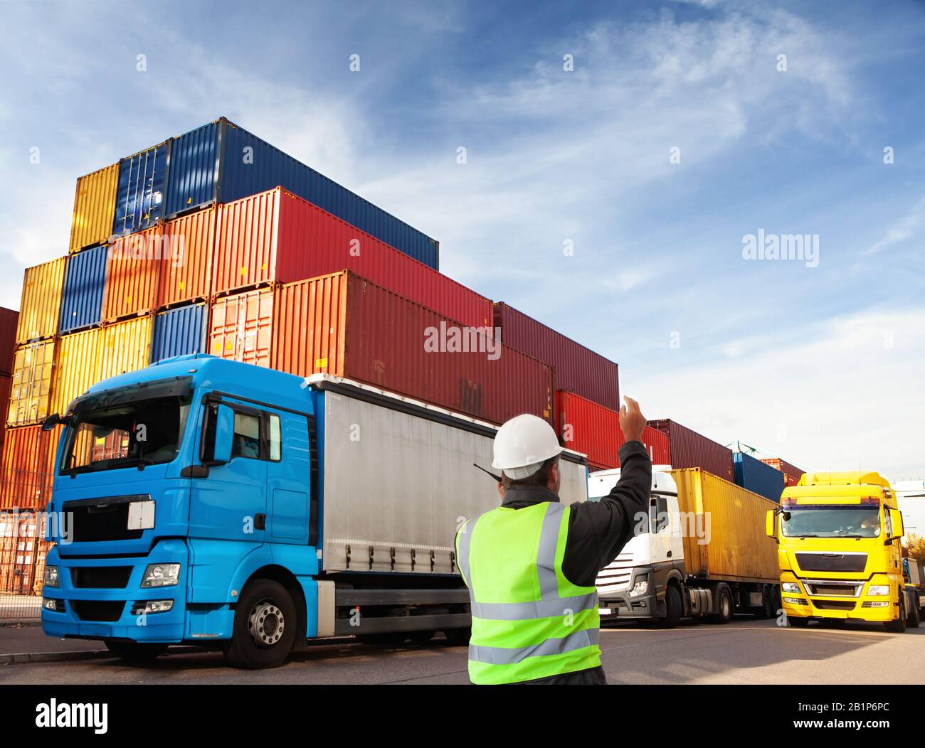 forwarding manager at container terminal with trucks controlling Stock ...
