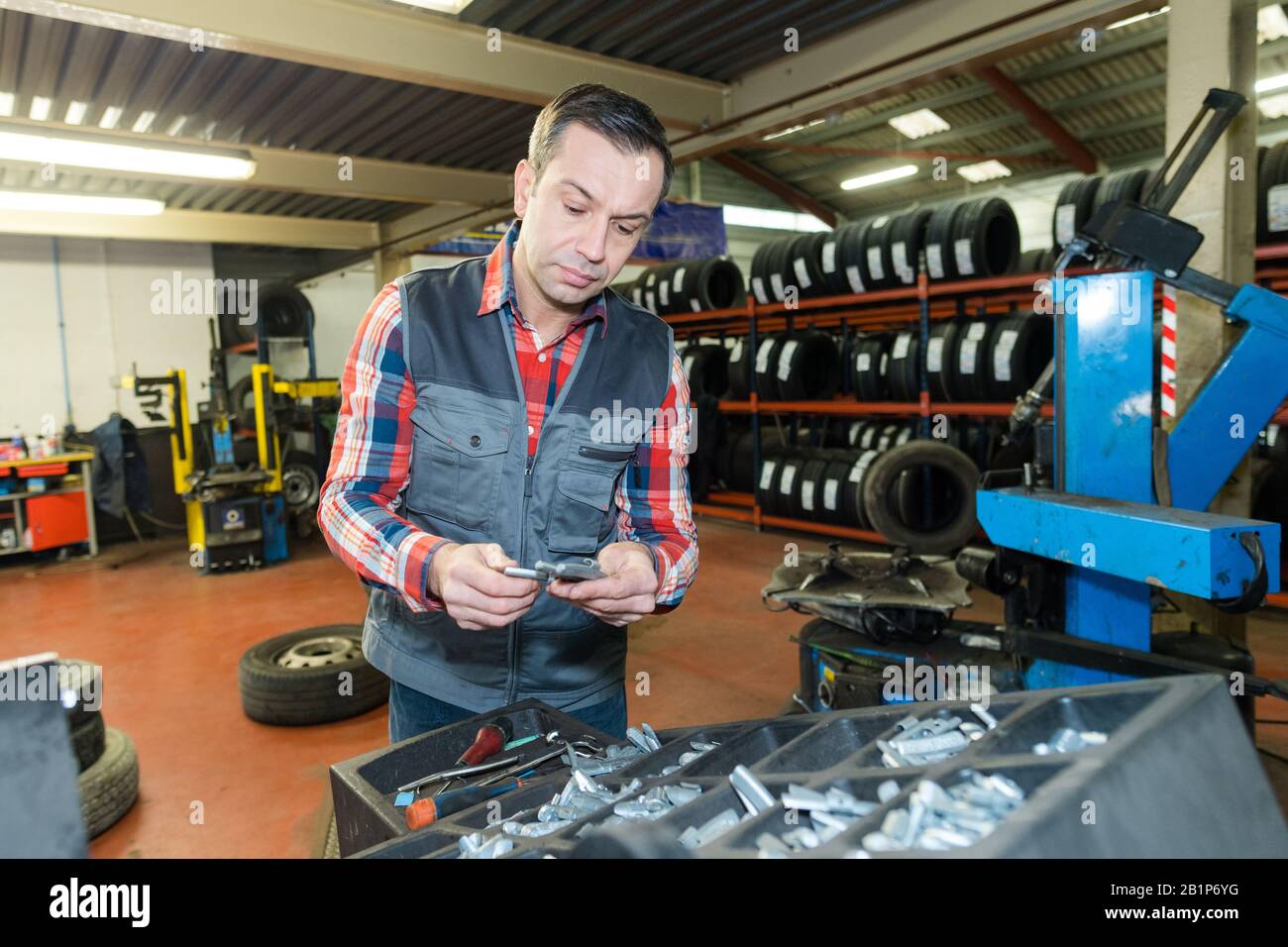 service man worker at factory workshop Stock Photo - Alamy