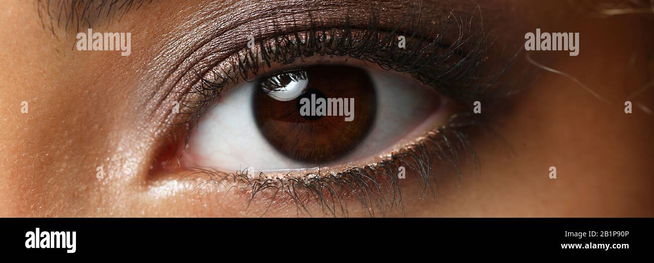 Eye of a black woman shot large macro Stock Photo - Alamy