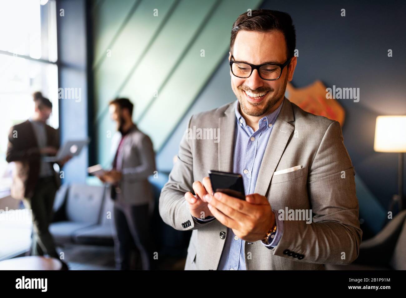 Happy casual man checking smart hi-res stock photography and images - Alamy