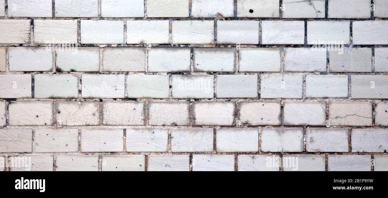 Old small tiles square shape on a wall - Empty abstract background for ...