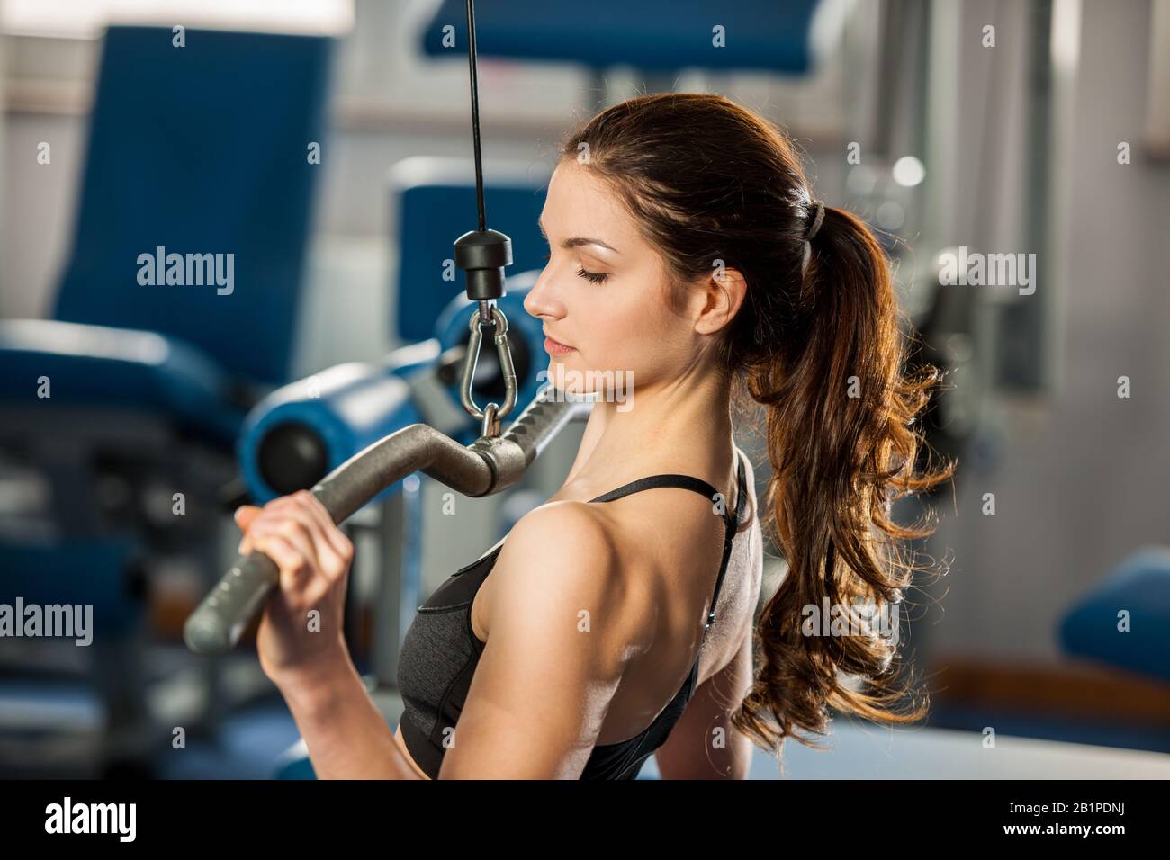 Beautiful fit woman works out in a fitness gym Stock Photo - Alamy