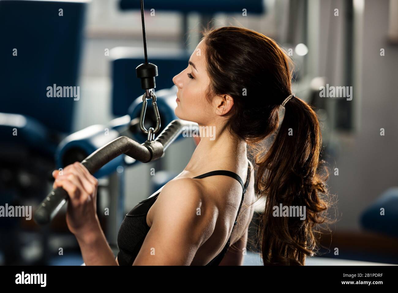 Beautiful fit woman works out in a fitness gym Stock Photo - Alamy