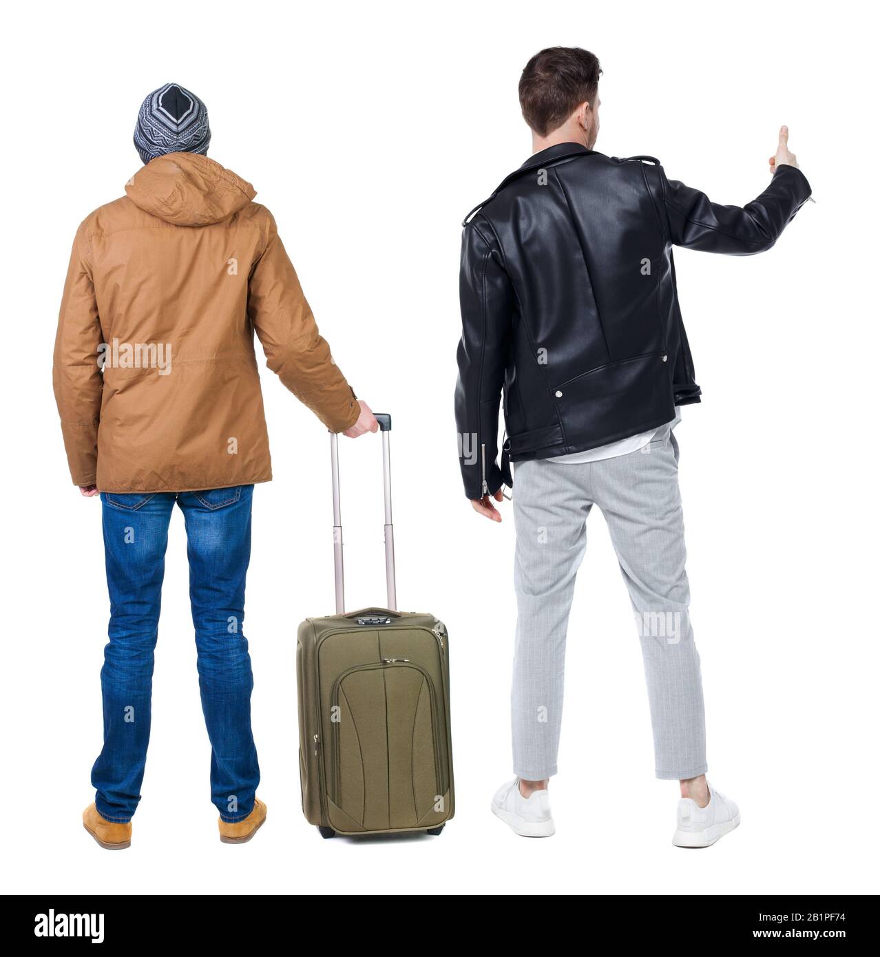 Back view of two man in winter jacket traveling with suitcas. Back view ...