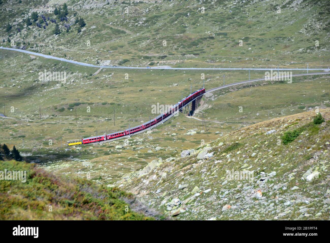 The UNESCO listed Bernina Express railway passing between St Moritz in ...