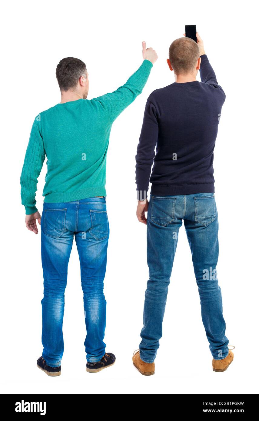 Back view of two man in sweater with mobile phone. Rear view people ...