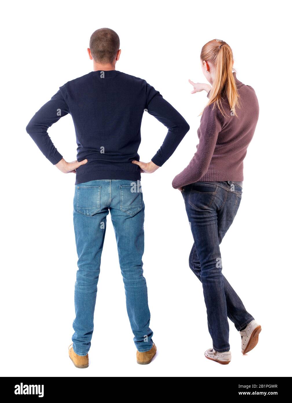 Back view of couple couple in sweater pointing. Rear view people ...