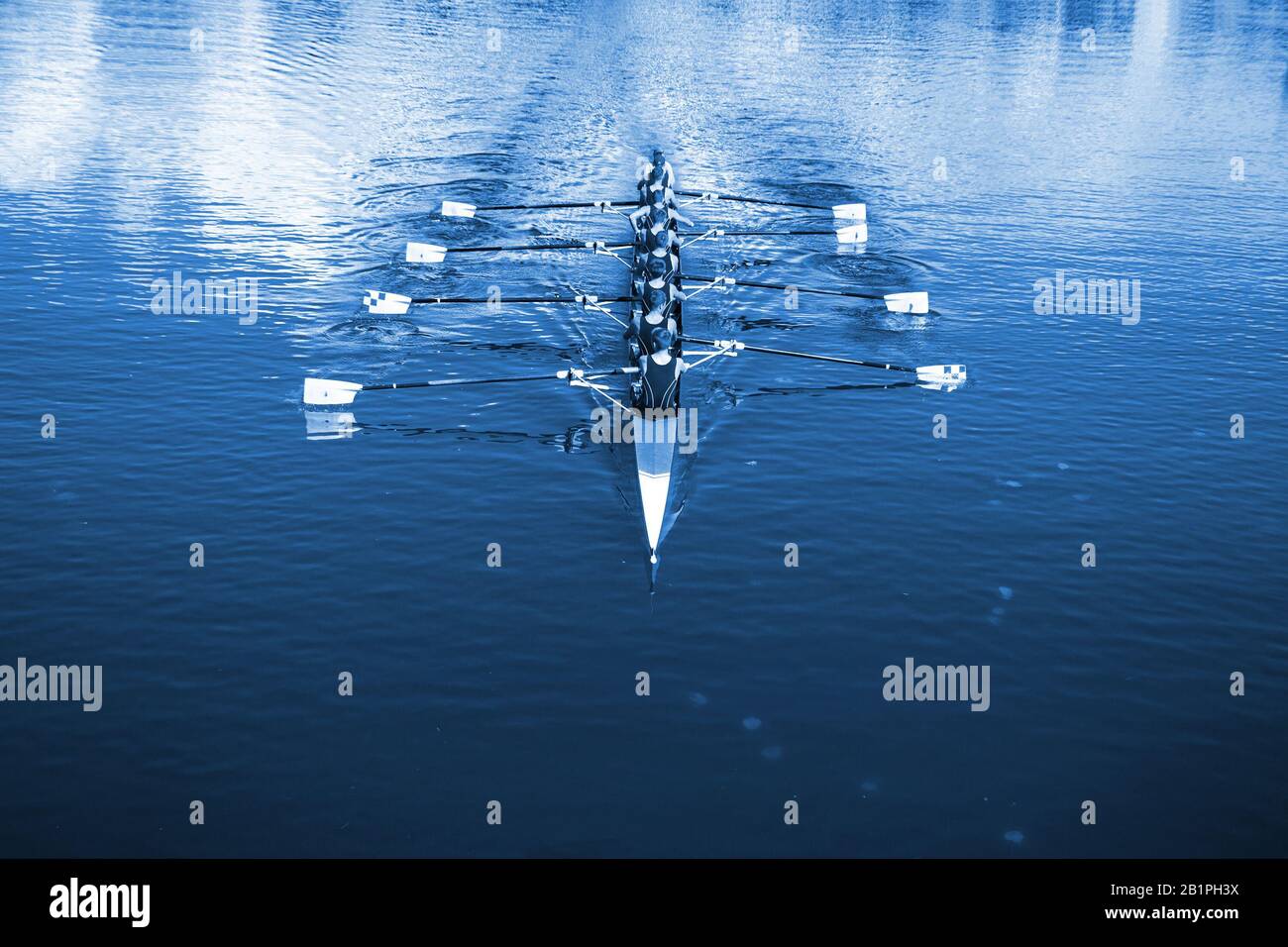 Boat coxed eight Rowers rowing on the tranquil lake. Classic Blue ...