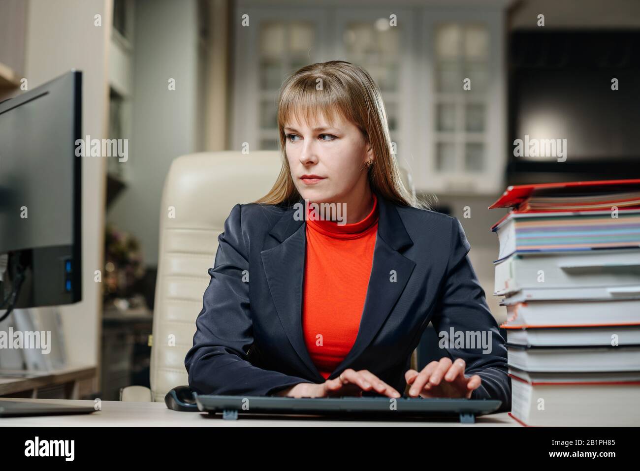 The programmer girl works at the computer information technology by hi ...