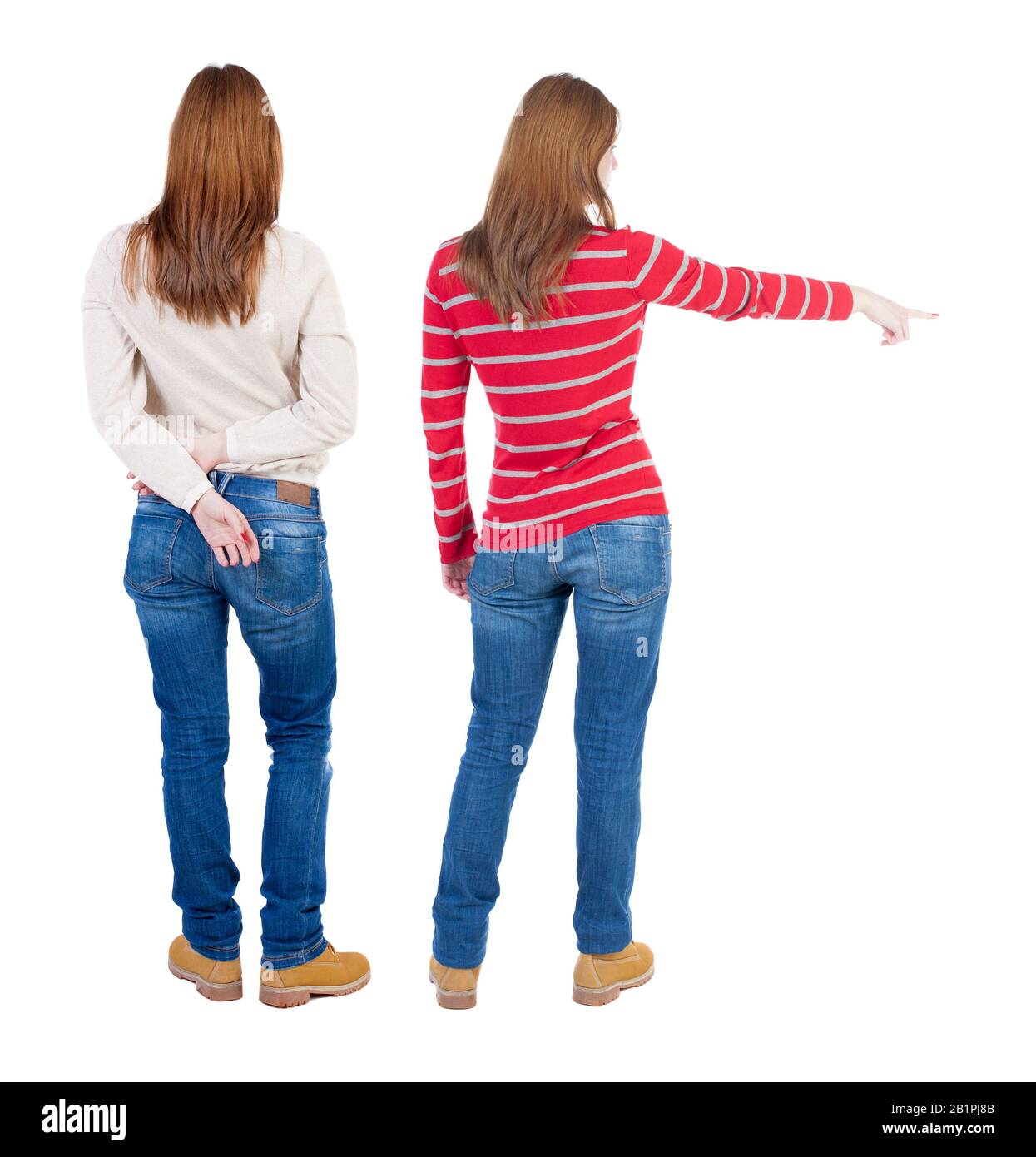 Back view of two pointing girl in sweater. Rear view people collection ...