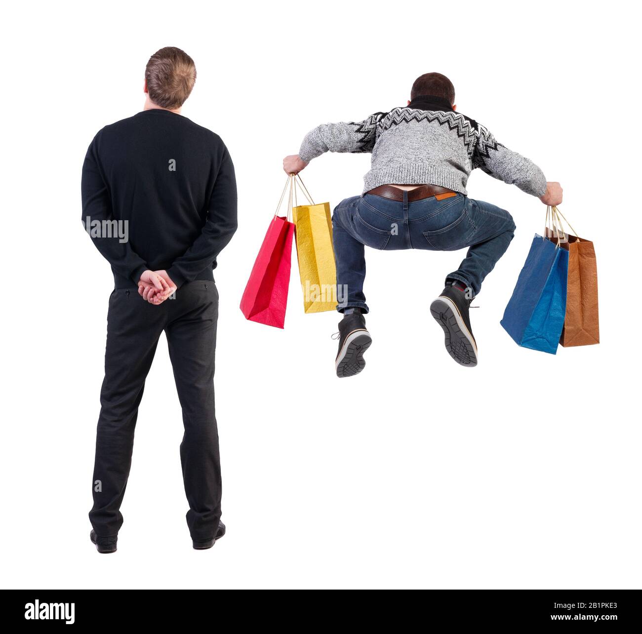 back view of two man with shopping bags. backside view of person. Rear ...