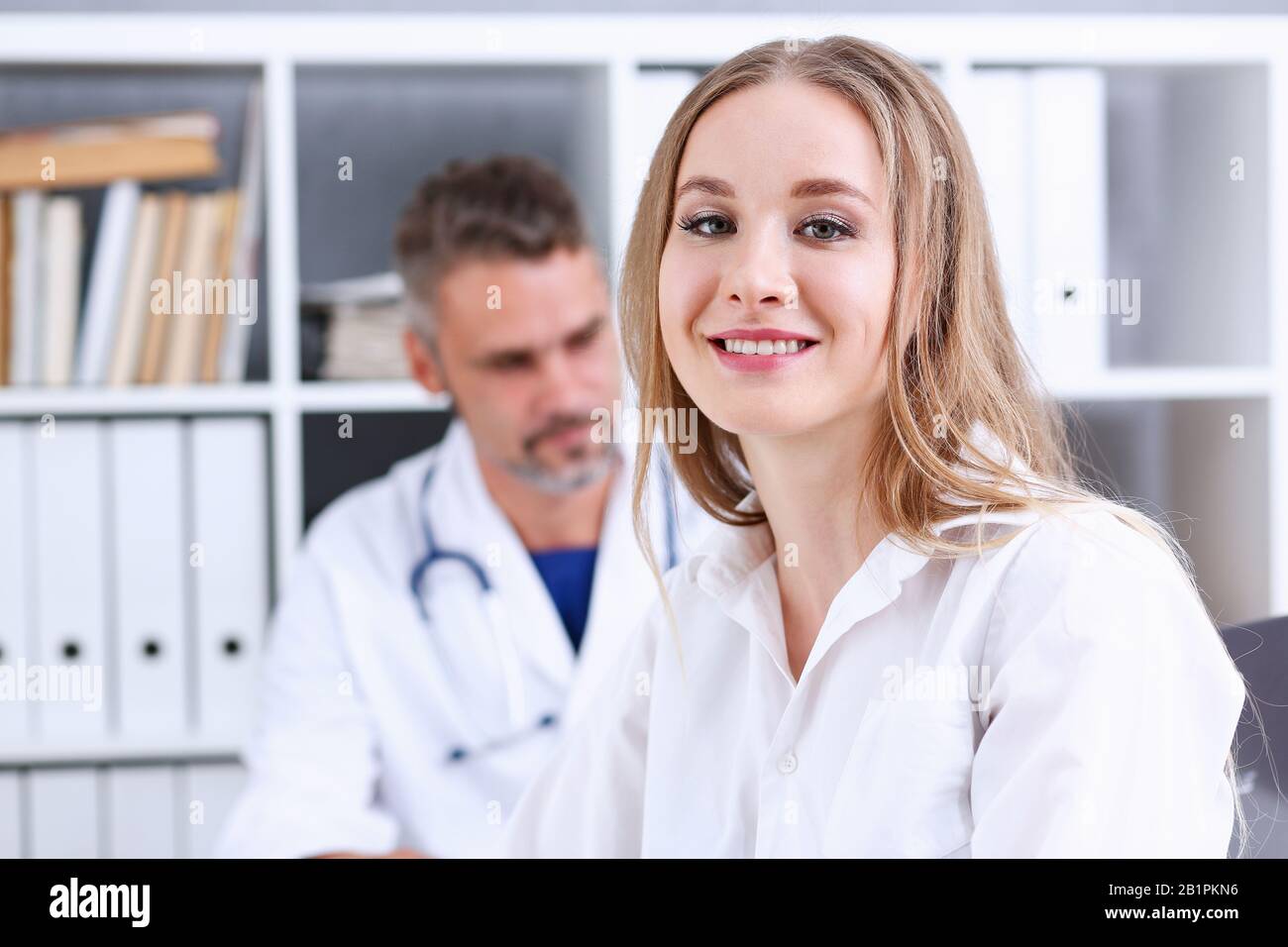 Satisfied happy beautiful smiling female patient Stock Photo - Alamy