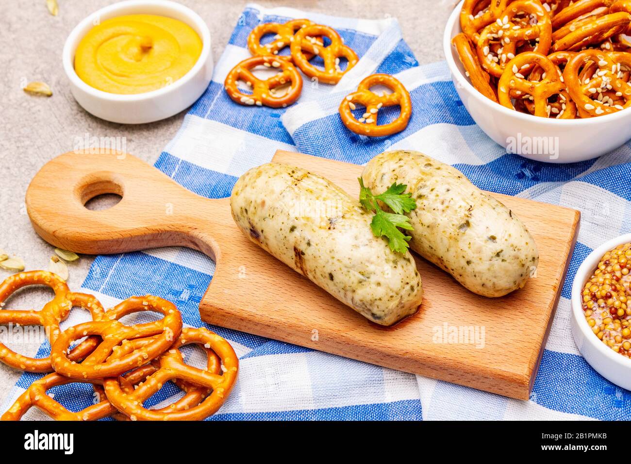 Oktoberfest set. White sausage weisswurst, pretzels, mustard, spikelets ...